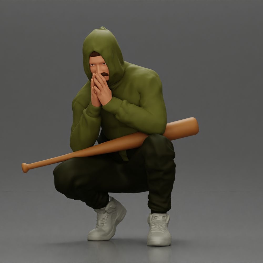Gangster crouching low in green hoodie holding bat planning move ...